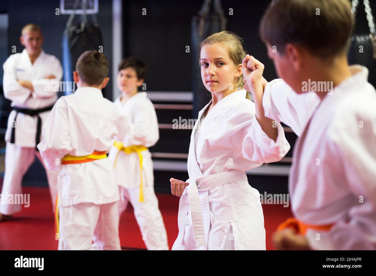 Children practicing new karate moves in pairs Stock Photo - Alamy