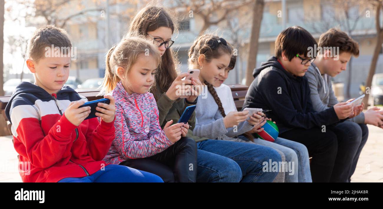 Children communicate via messengers on phones Stock Photo - Alamy