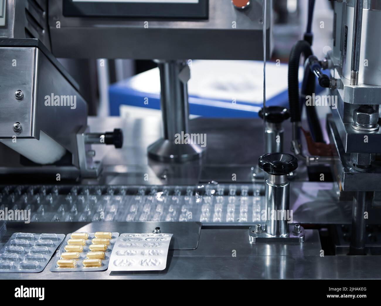 Capsule blister packing machine in pharmaceutical industry Stock Photo ...