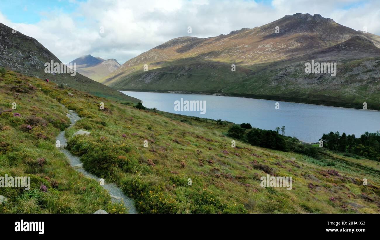 An aerial view of the rural rocky mountains near water in Northern ...