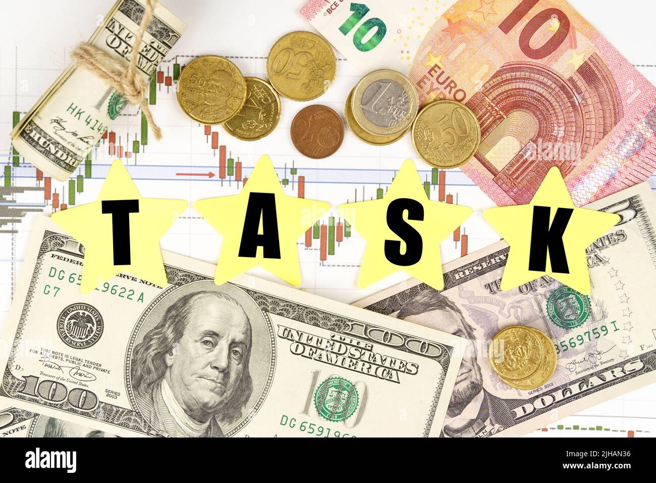 Finance and economics concept. Among the charts and money are asterisks ...