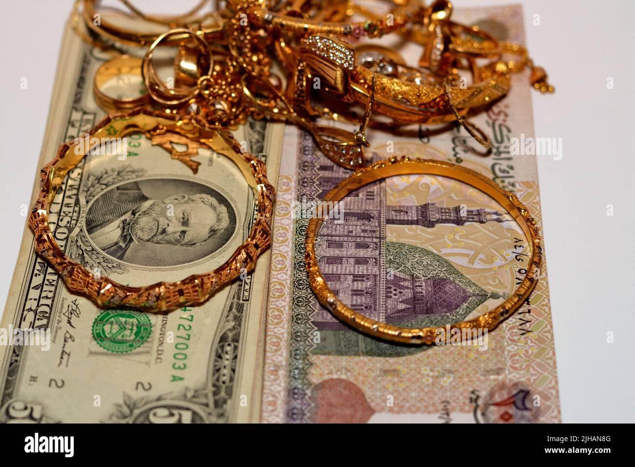 A pile of Egyptian pounds and American dollars money banknotes with a ...