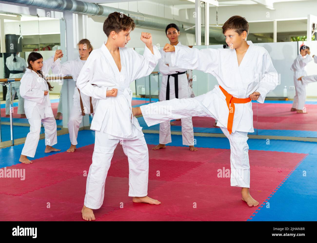 Girls and boys sparring during karate training Stock Photo - Alamy