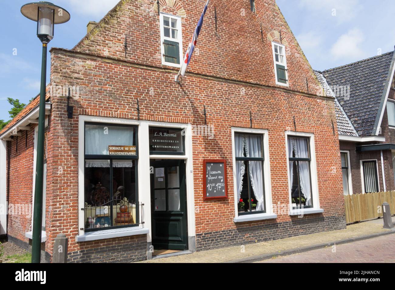 Ancient Dutch grocery in the small village Exmorra in Friesland in the ...