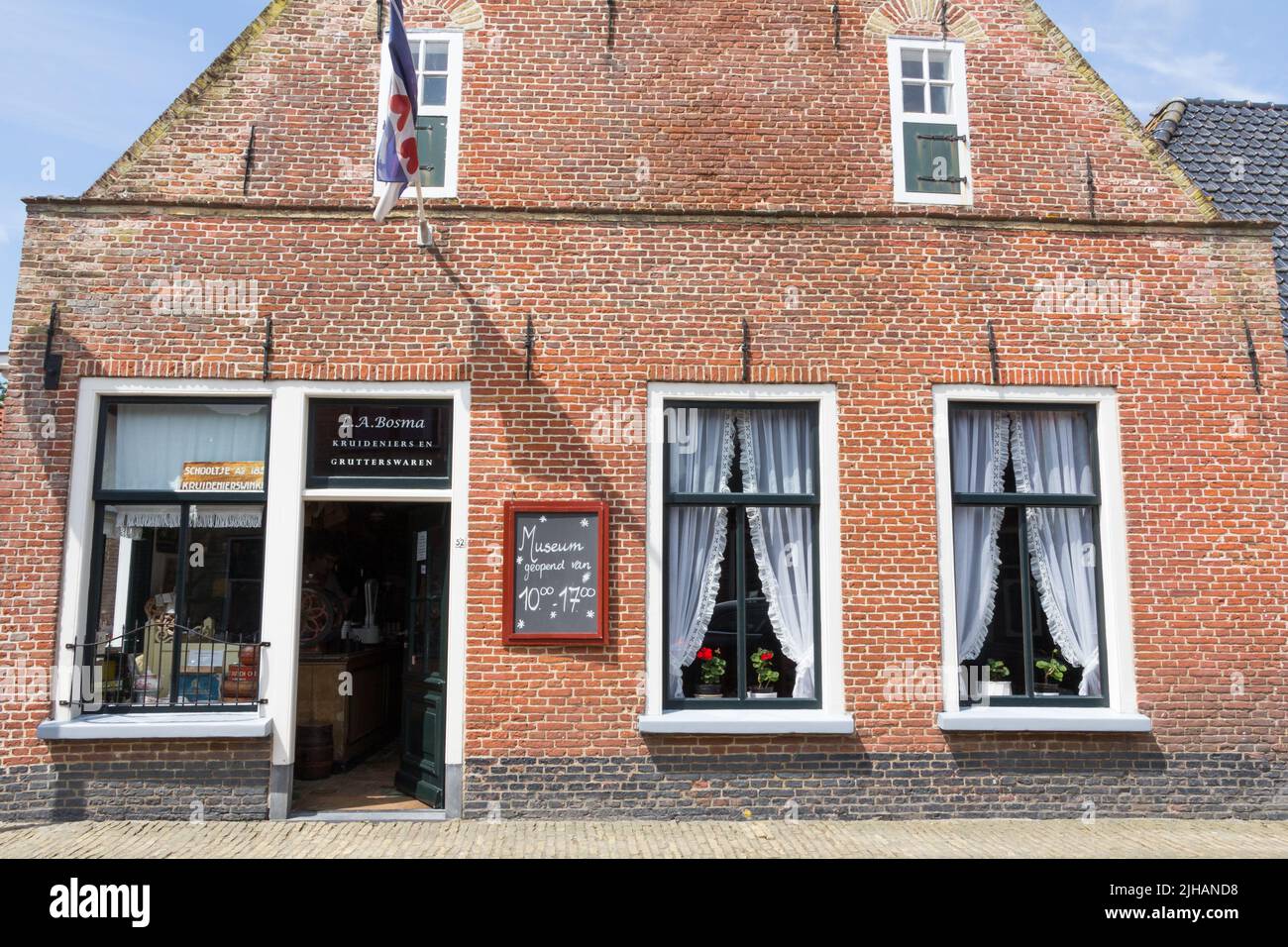 Ancient Dutch grocery in the small village Exmorra in Friesland in the ...