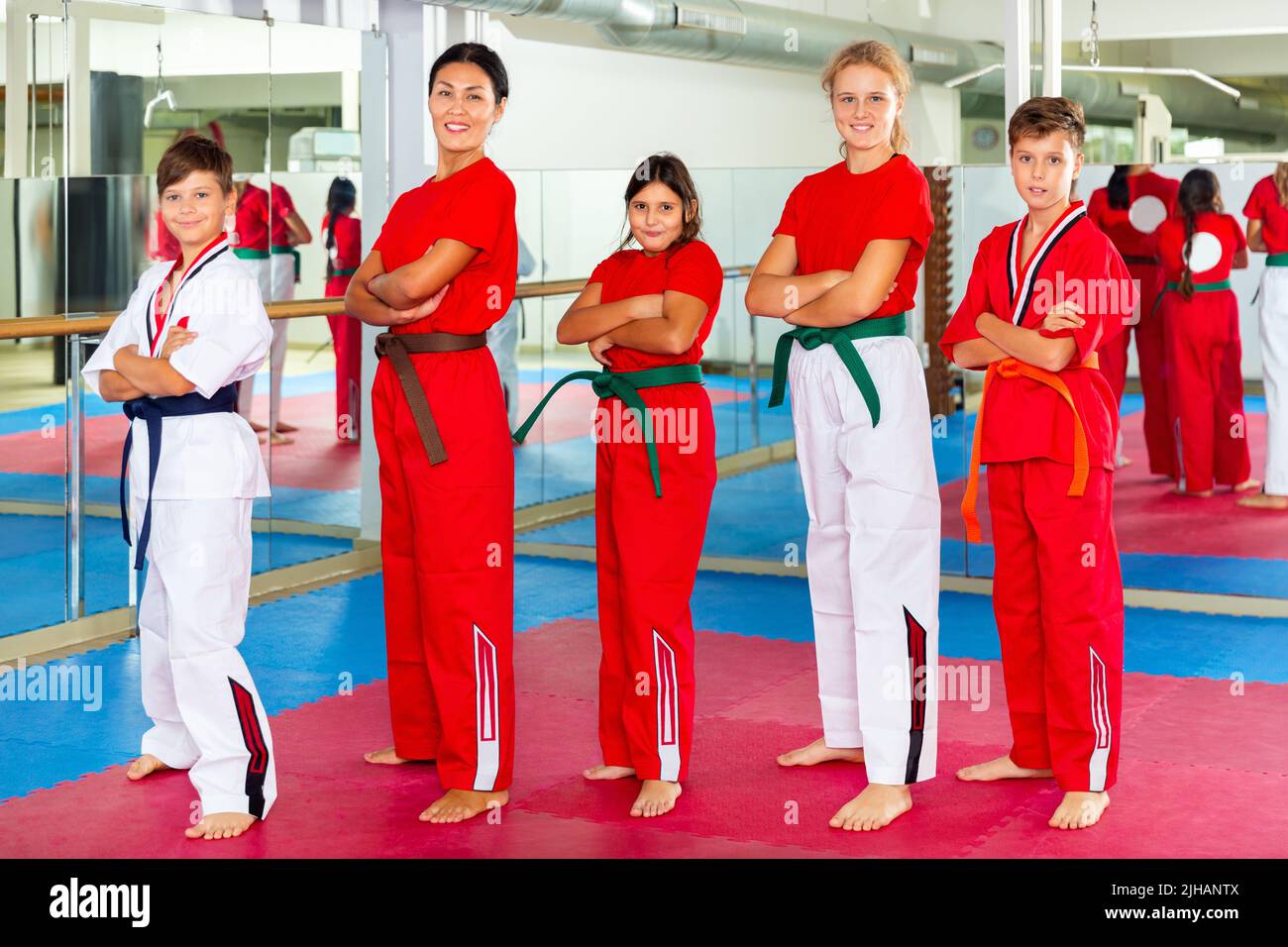 Group photo of kids and karate trainer in gym Stock Photo - Alamy