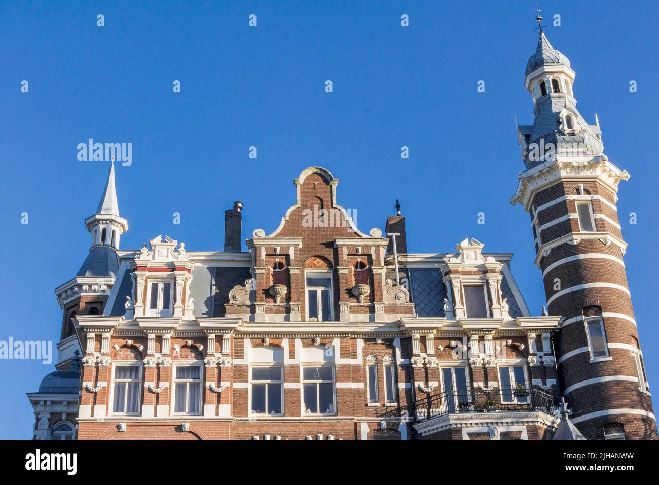 Old Dutch mansion house in front of a blue sky in the center of the ...
