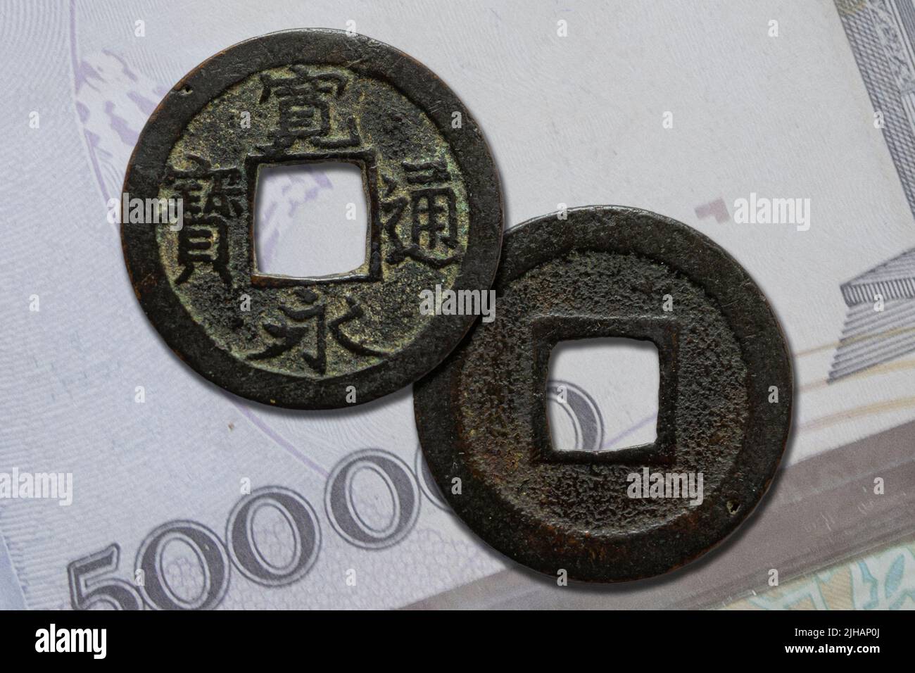 A close-up shot of 17th-century Japanese Mon coins Stock Photo - Alamy
