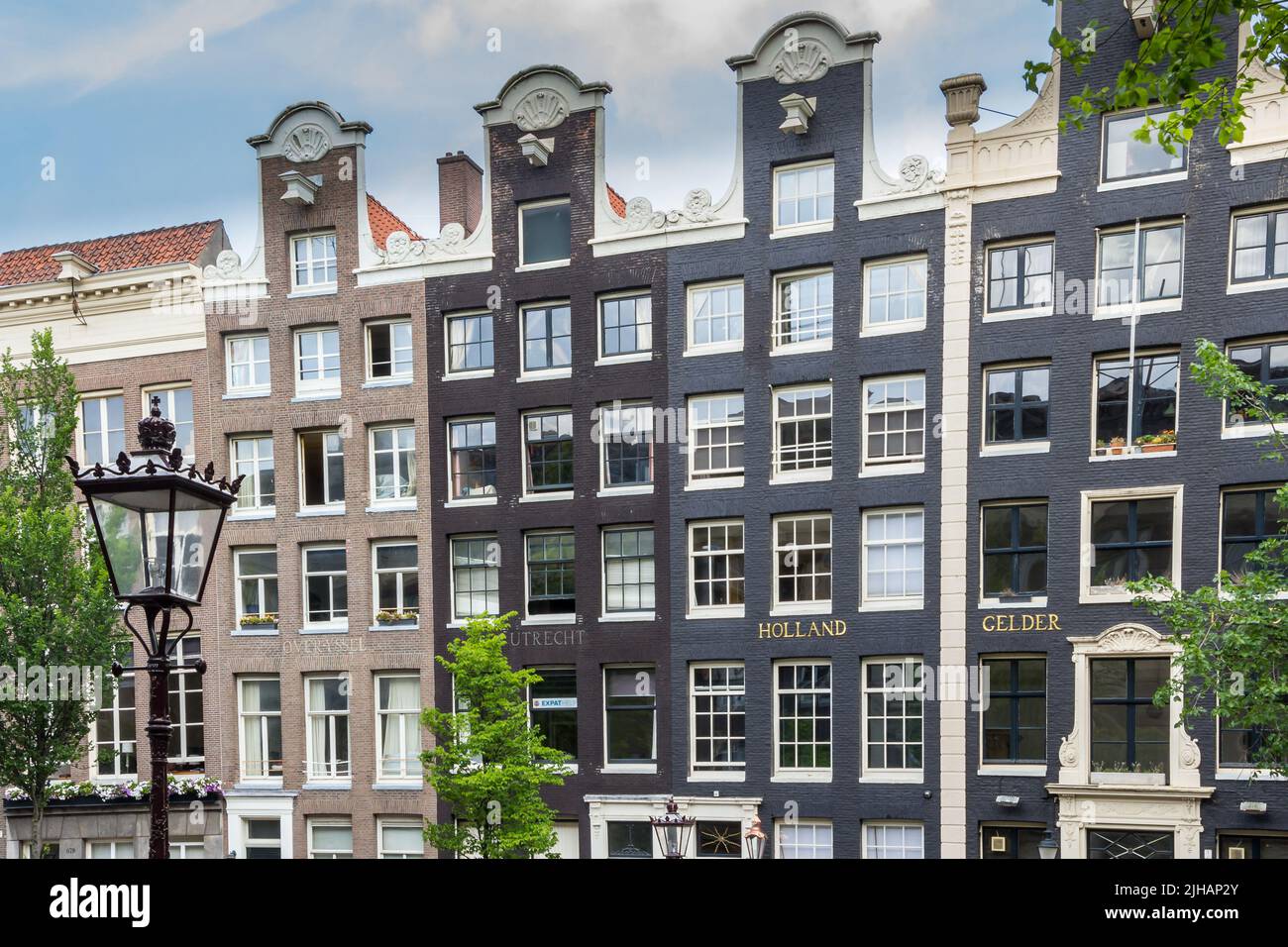 Typical dutch mansion houses along the canals in Amsterdam in the ...