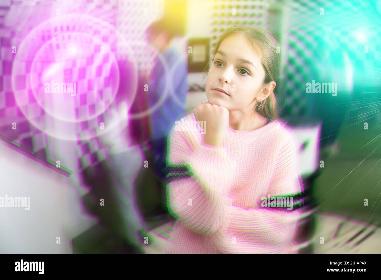 Girl in quest room with friends, trying to find solution of conundrum ...