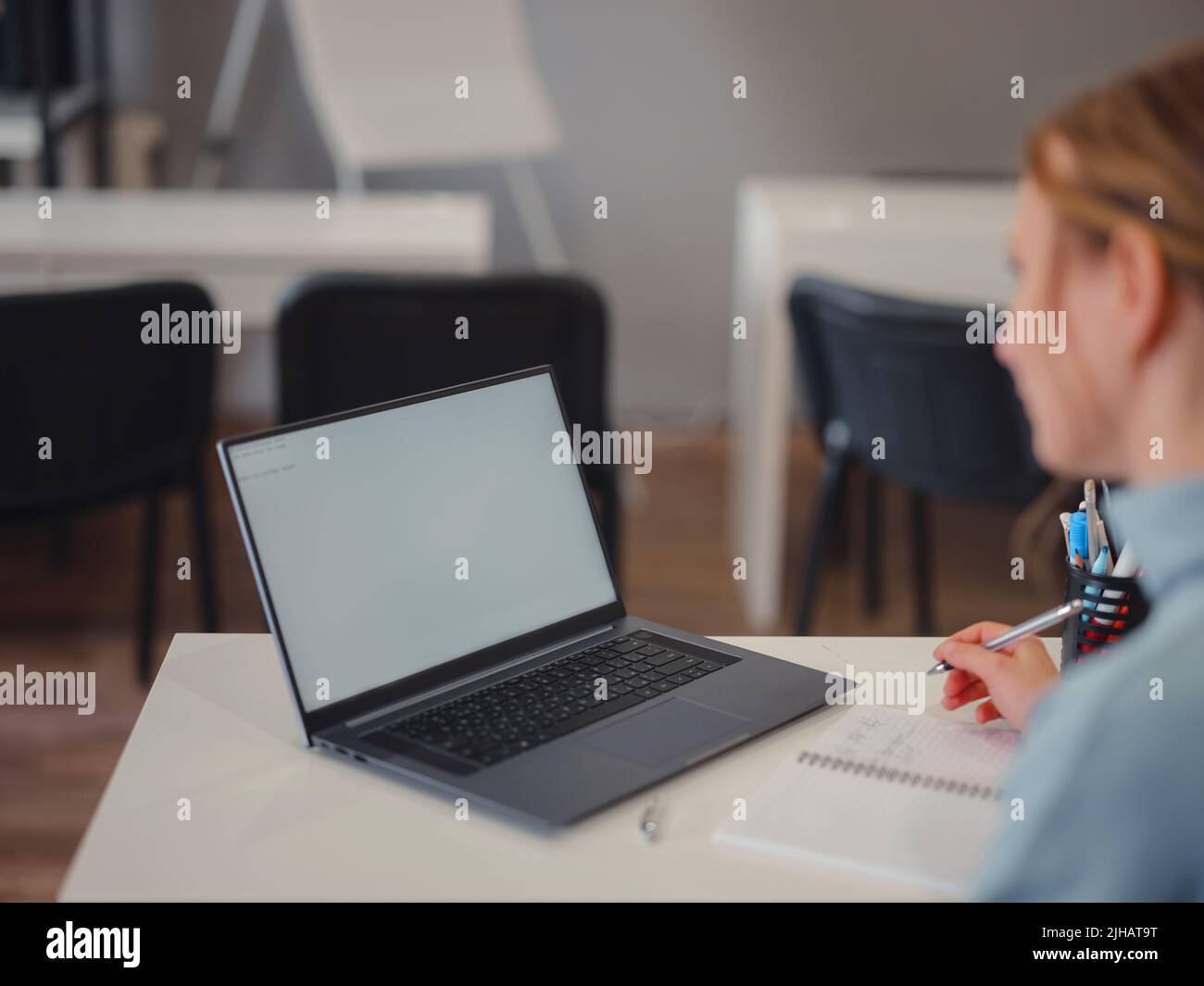 Business woman in blue dress working in office. Online business, young ...