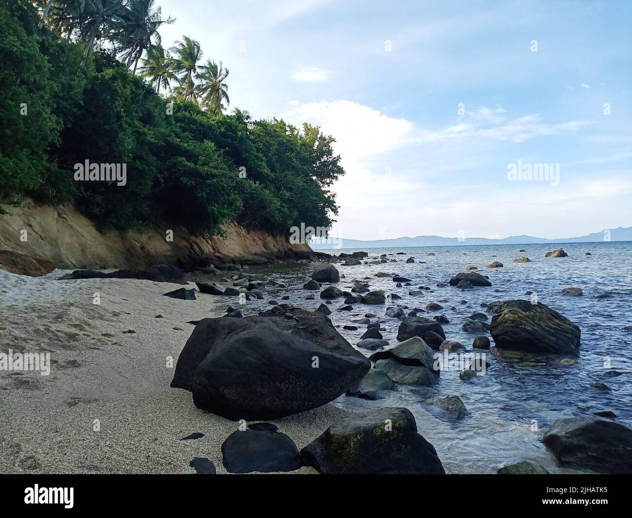 A rocky white beach view Stock Photo - Alamy