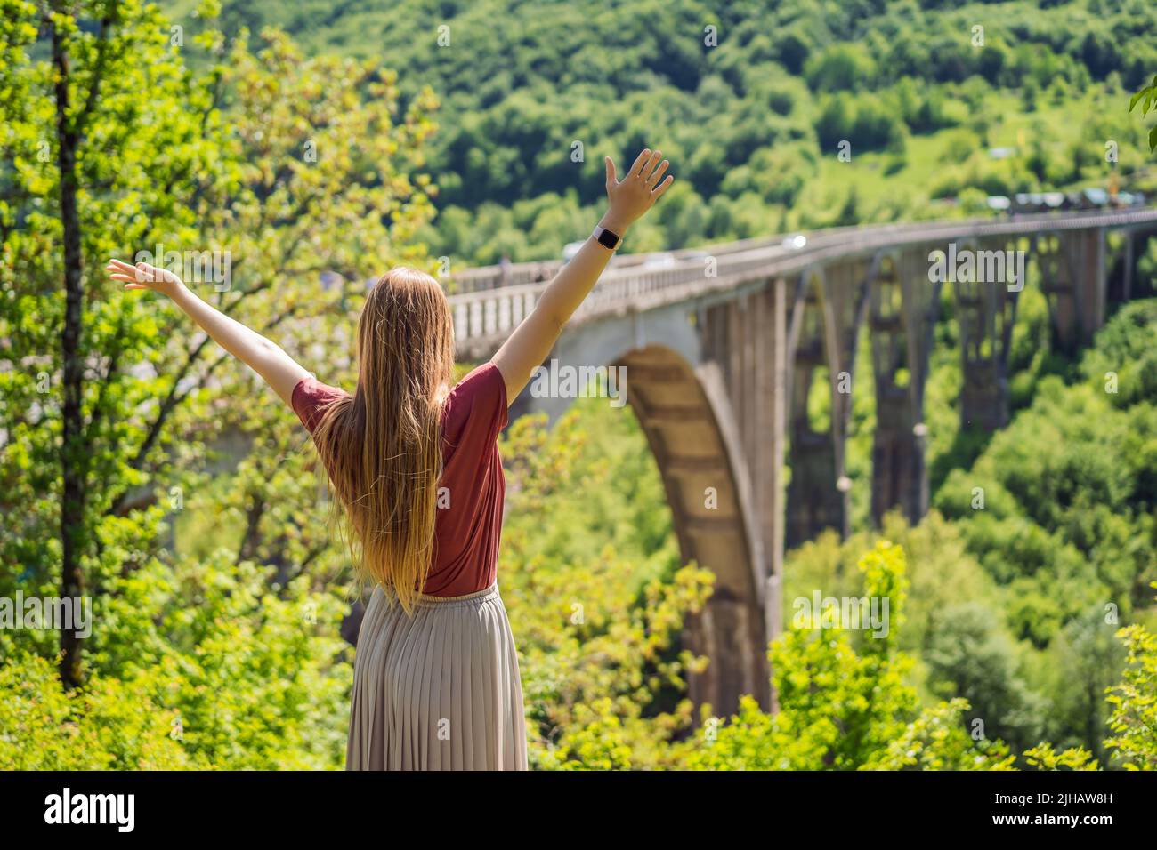 Montenegro. Woman tourist in background of Dzhurdzhevich Bridge Over ...
