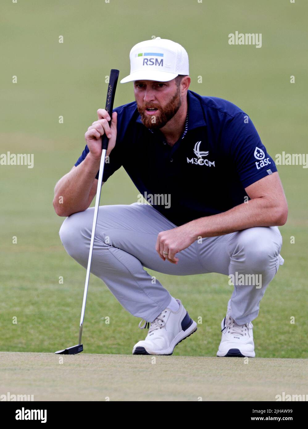 USA's Chris Kirk lines up a putt on the 1st during day four of The Open ...