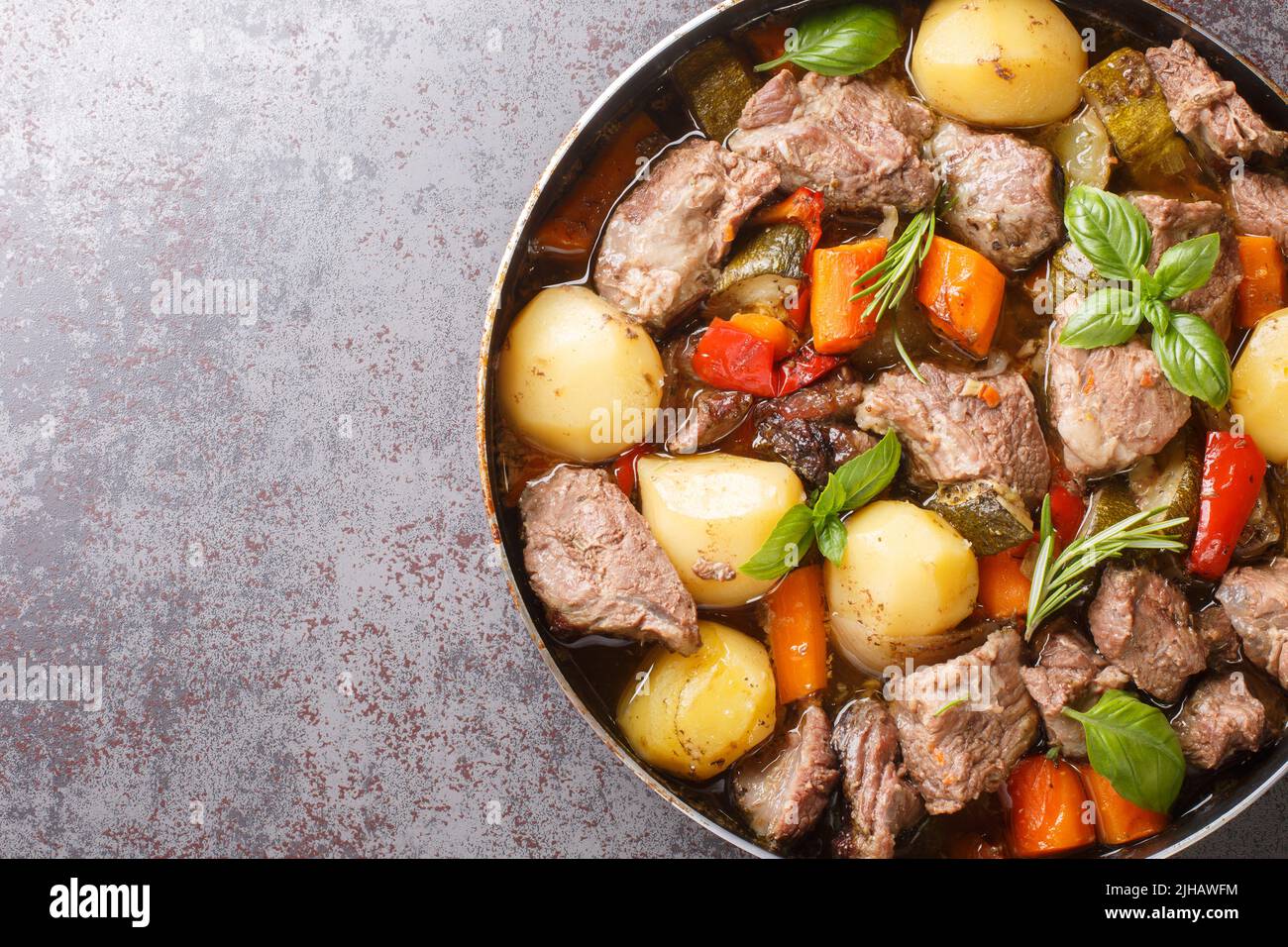 Traditional meat peka with potatoes, carrots, onions, peppers and ...