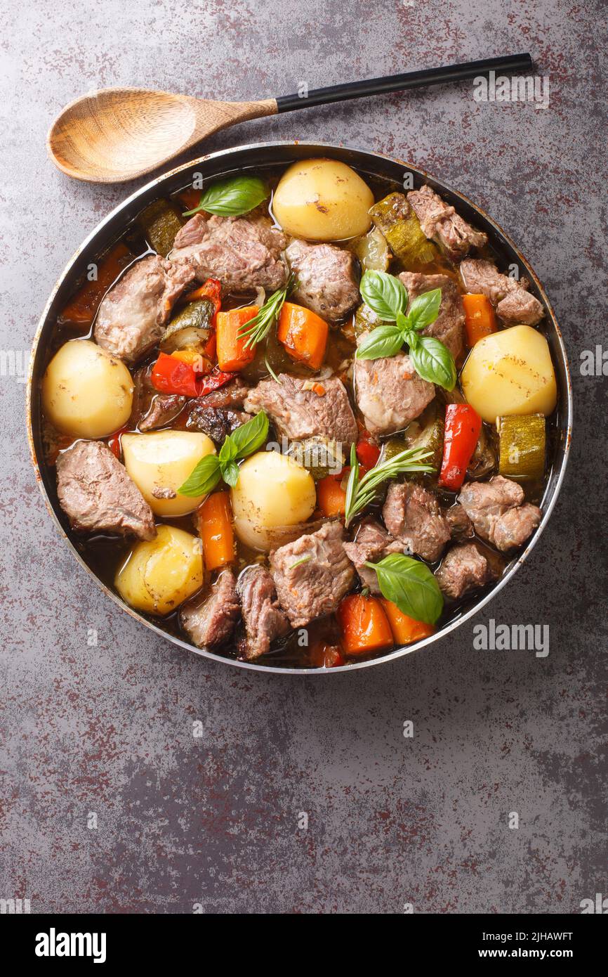 Peka Croatian Meat and Vegetable Stew close-up on the table. Vertical ...