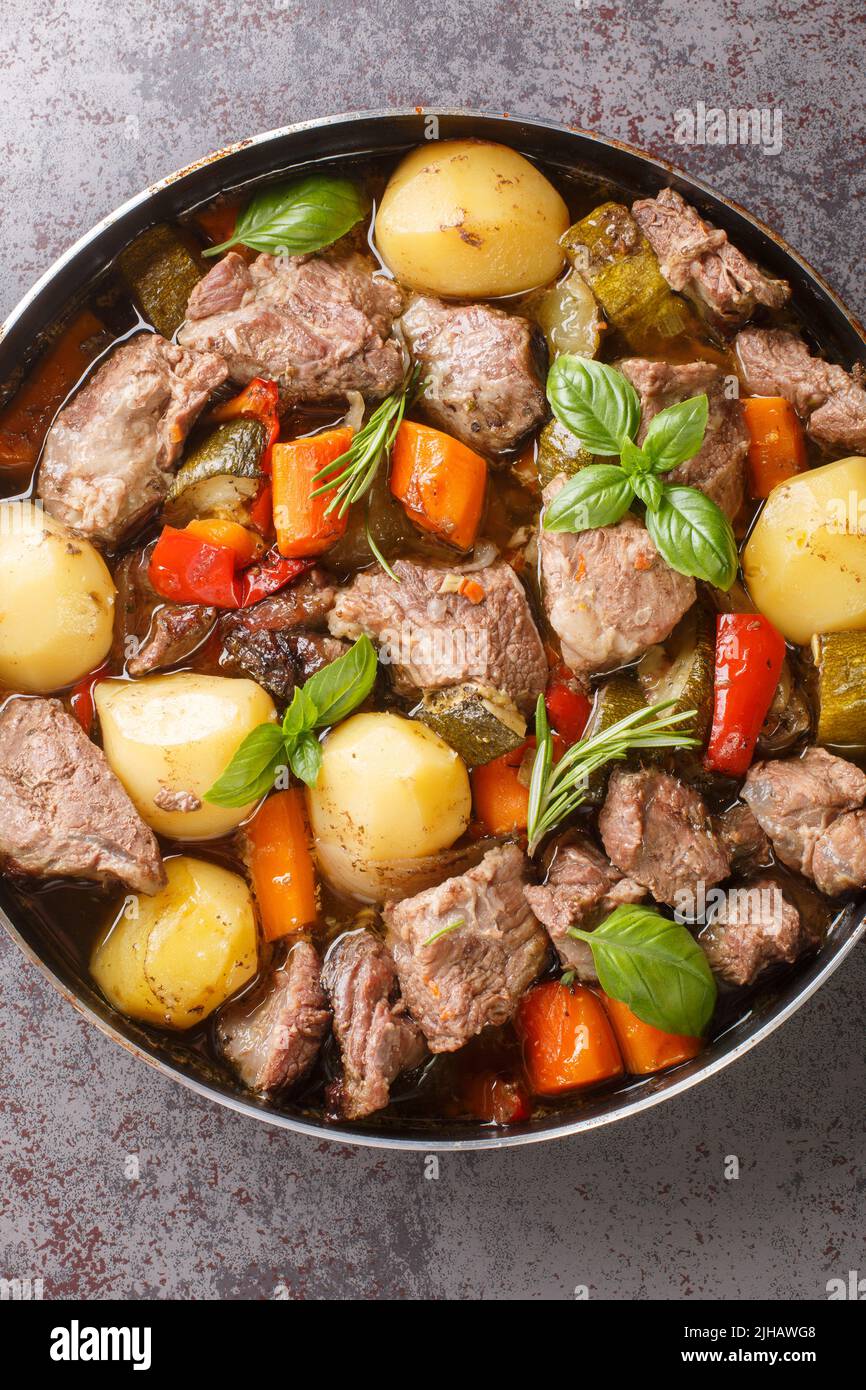 National Croatian food peka cooked with meat and vegetables over an ...
