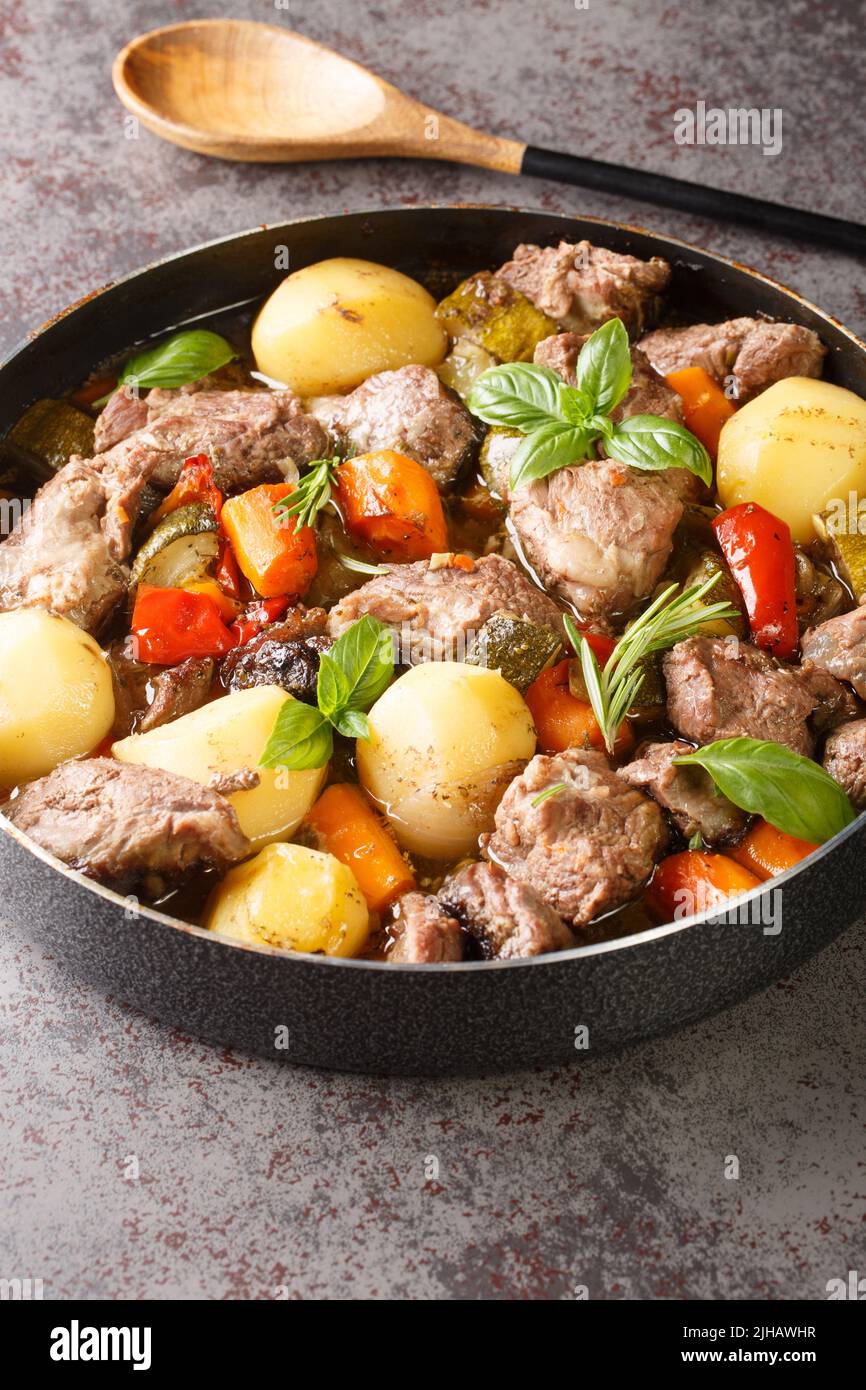 Peka Croatian Meat and Vegetable Stew close-up on the table. Vertical ...