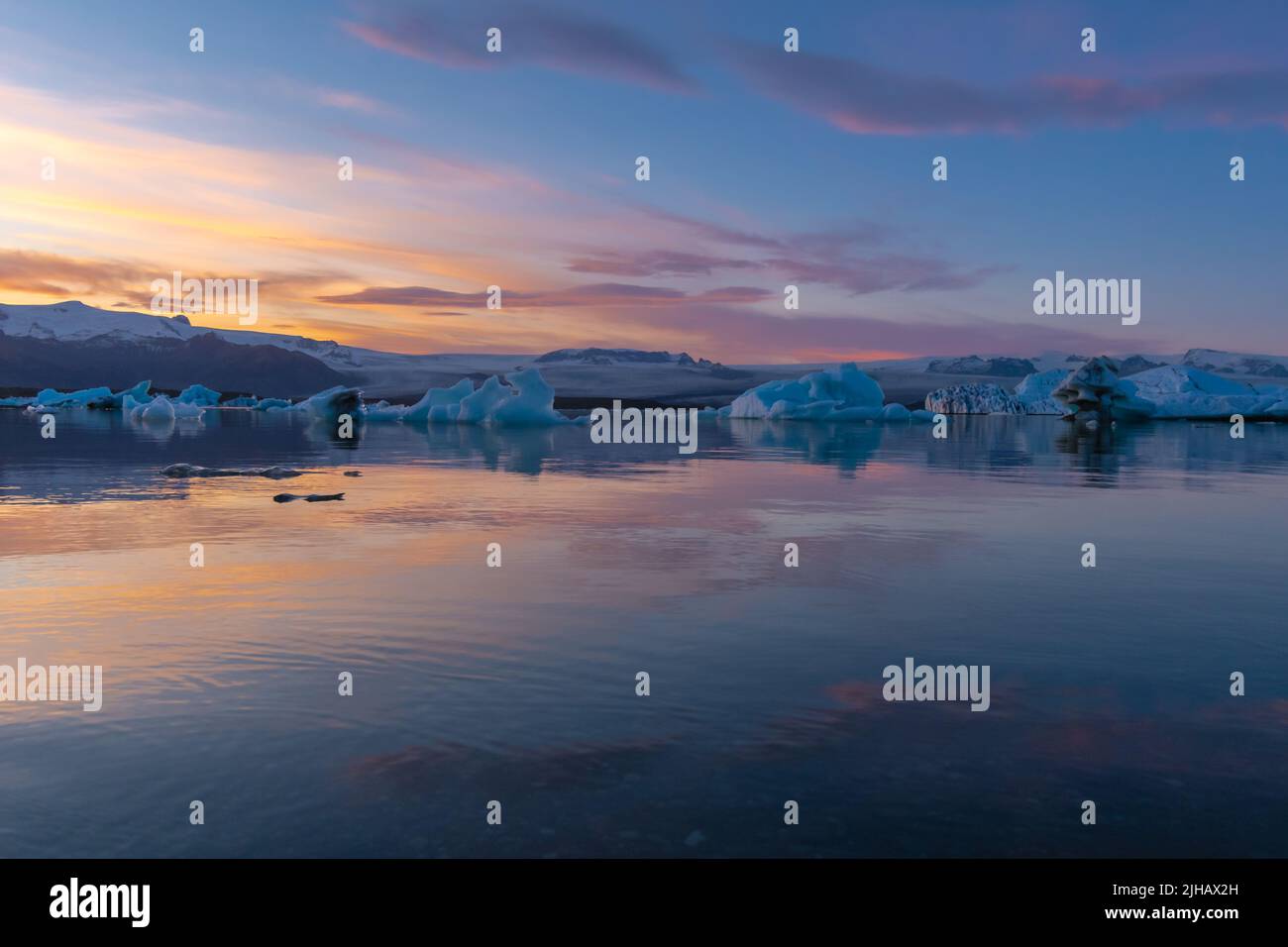 the incredible glacier in Iceland the Jökulsárlón at sunset, an ...