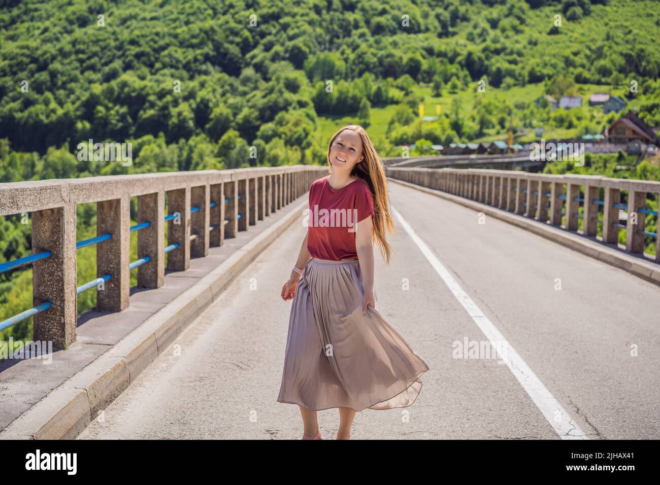 Montenegro. Woman tourist in background of Dzhurdzhevich Bridge Over ...