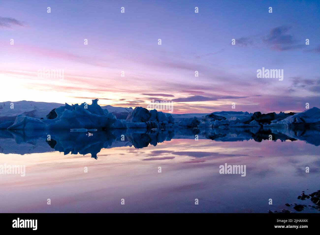 the incredible glacier in Iceland the Jökulsárlón at sunset, an ...