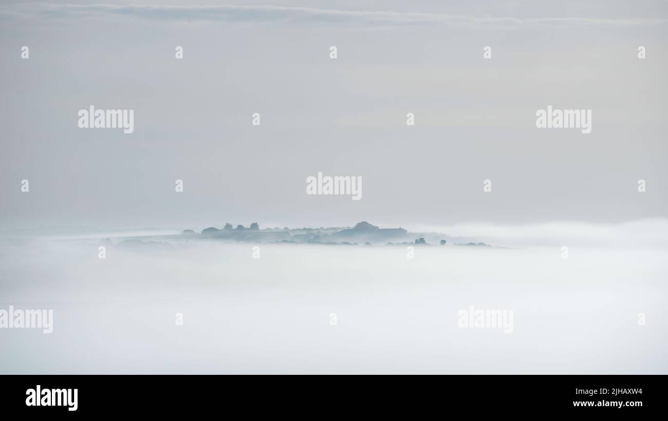 Beautiful landscape image of sea of fog rolling across South Downs ...