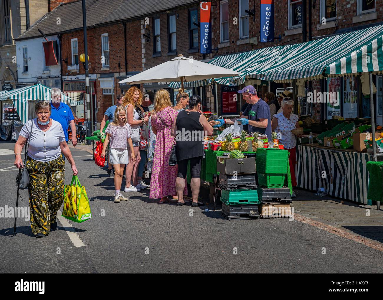 Grantham, Lincolnshire, UK – Shoppers at the traditional street market ...