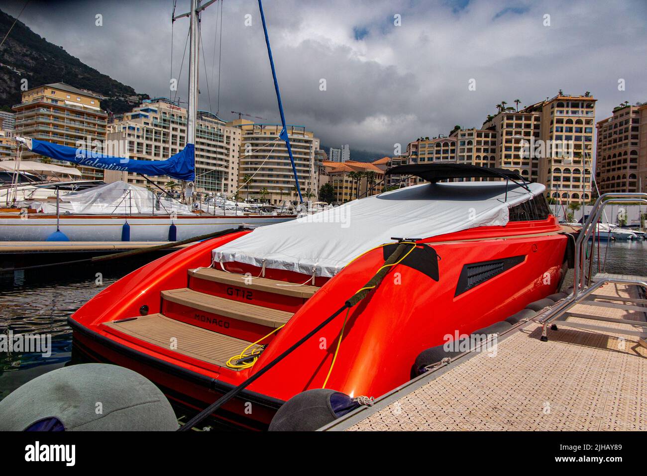 A red luxury speedboat in the port of Cap d'Ail on the Cote d'Azur in ...