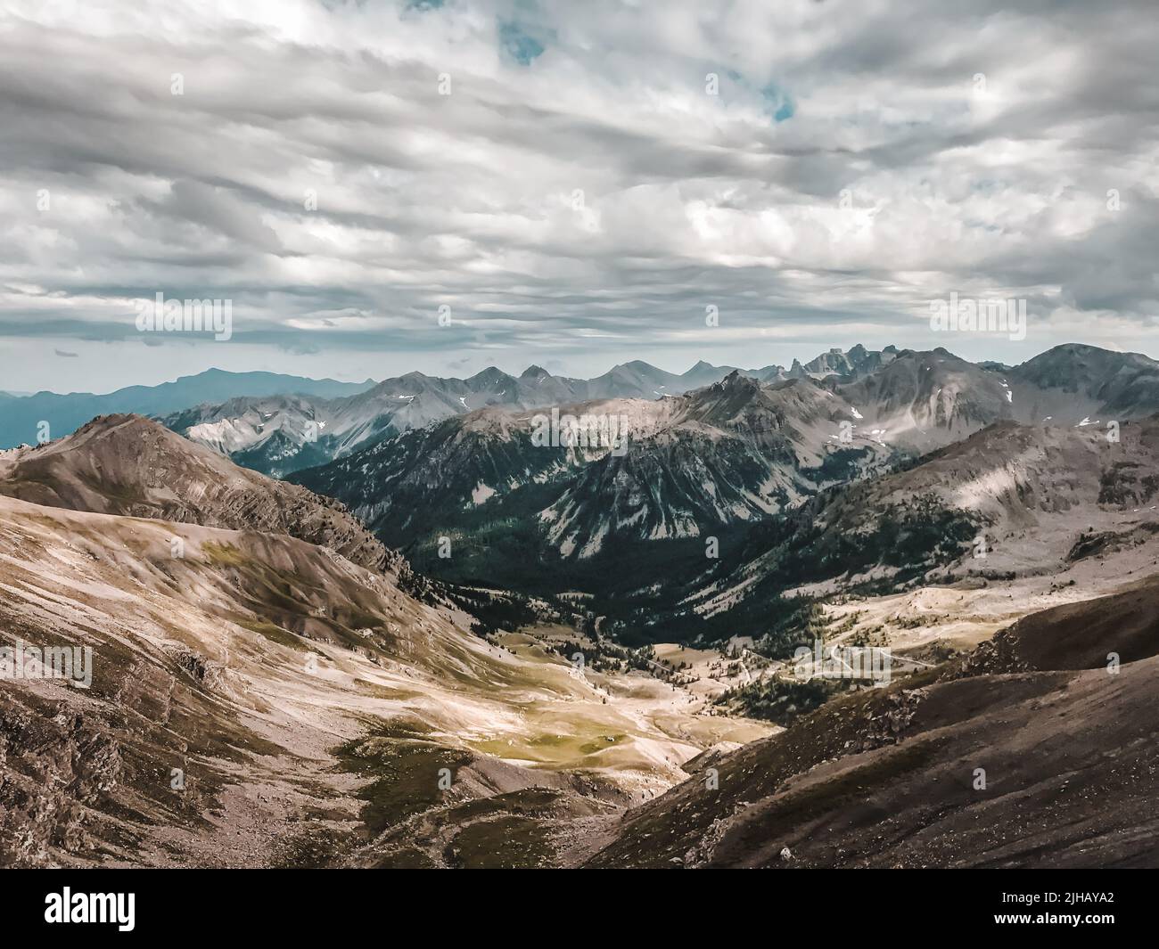 Mountain landscape, mountain hills and ridges under overcast skies ...