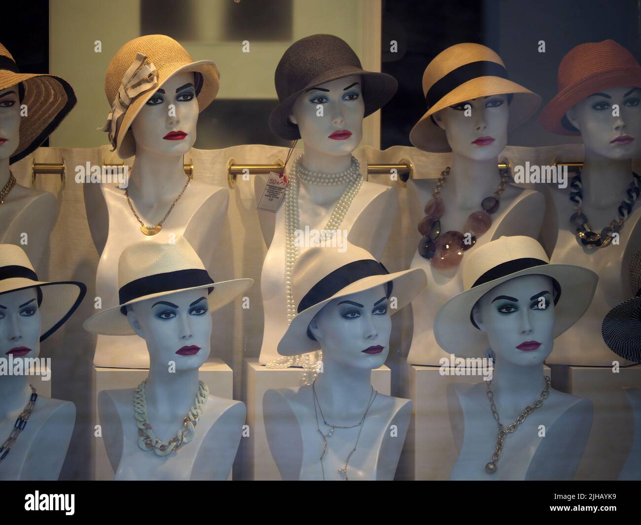 Mannequins in hats in a shop window, Passau, Germany Stock Photo - Alamy