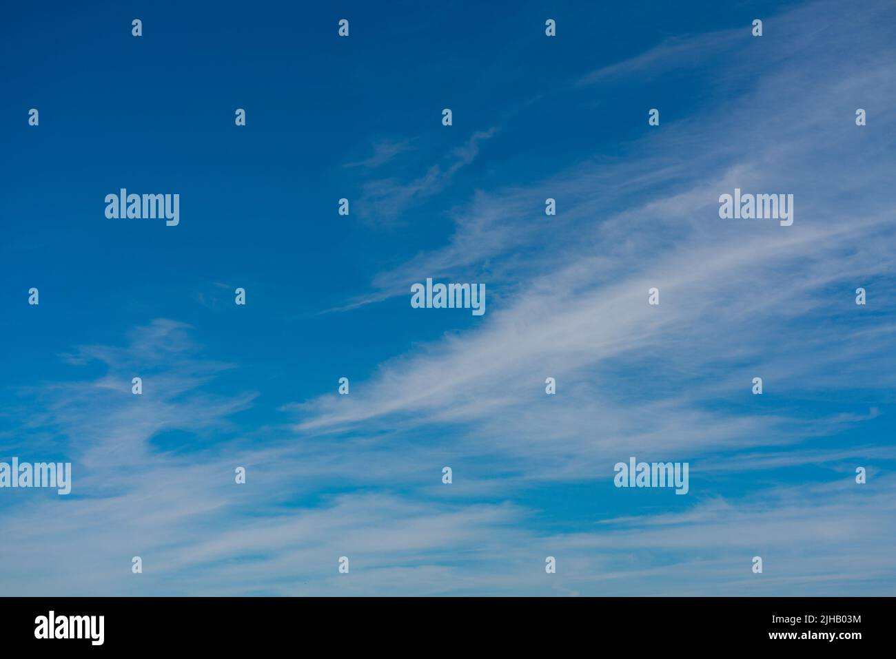 Amazing blue background with light haze of clouds Stock Photo - Alamy