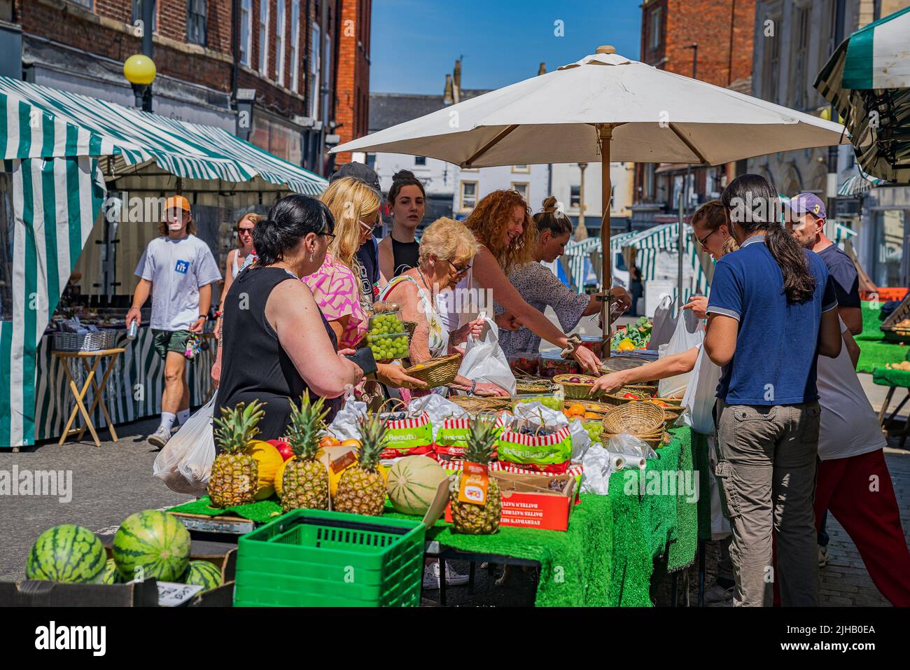 Grantham, Lincolnshire, UK – Shoppers at the traditional street market ...