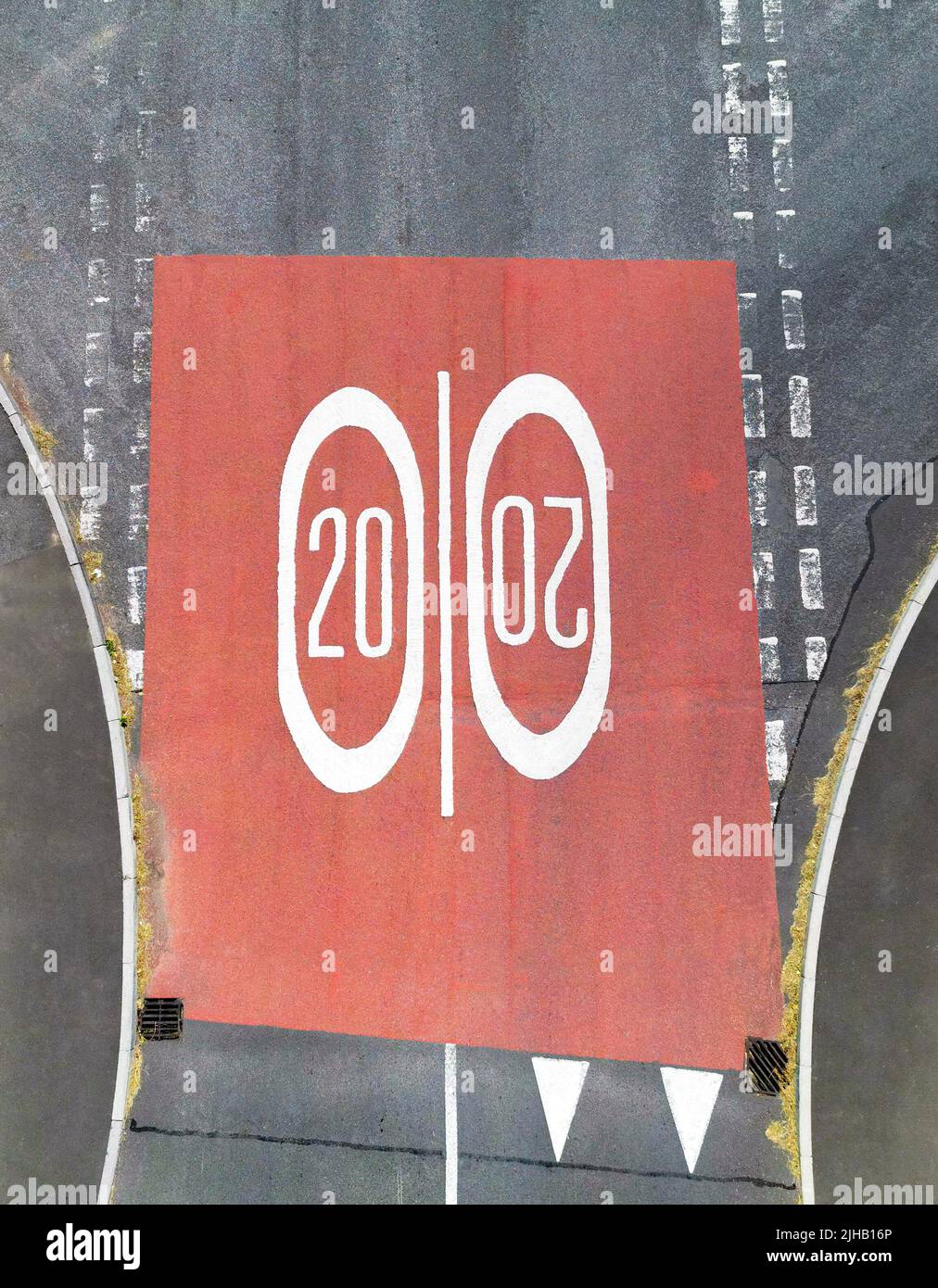 Overhead aerial view of road markings for a 20 mph speed limit in a ...
