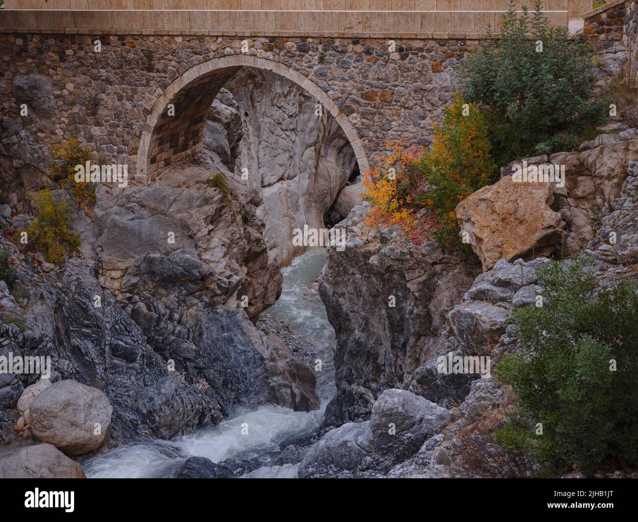 travel to Turkey, Kemer in autumn seasone. ancient Roman bridge over a ...
