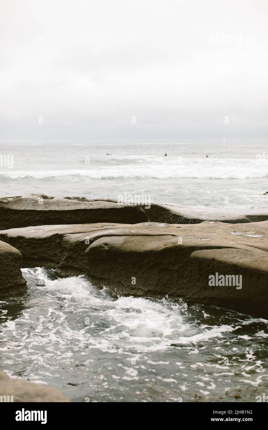 A vertical shot of pacific ocean tide pools on a cloudy day Stock Photo ...