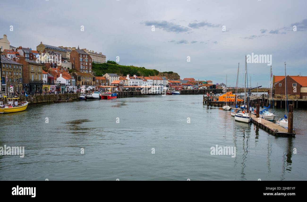 A view of Whitby harbour looking towards the harbour entrance and Pier ...