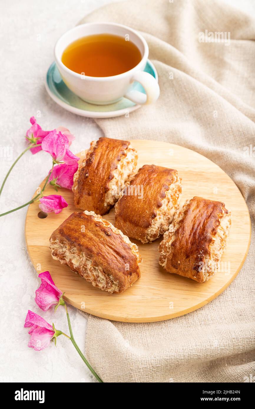 Traditional armenian dessert gata with cup of green tea on a gray ...