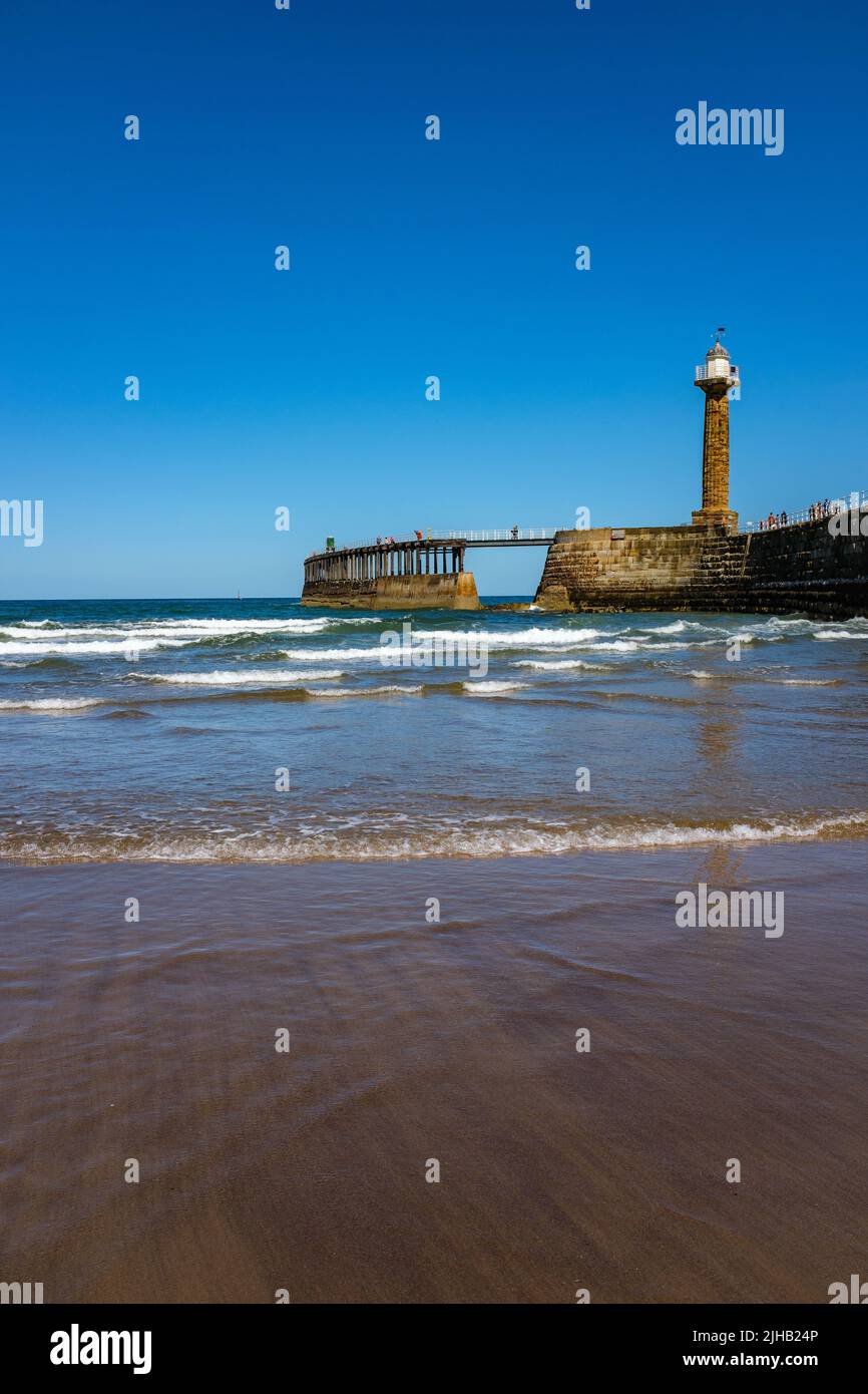 The west pier at Whitby showing the west lighthouse Stock Photo - Alamy