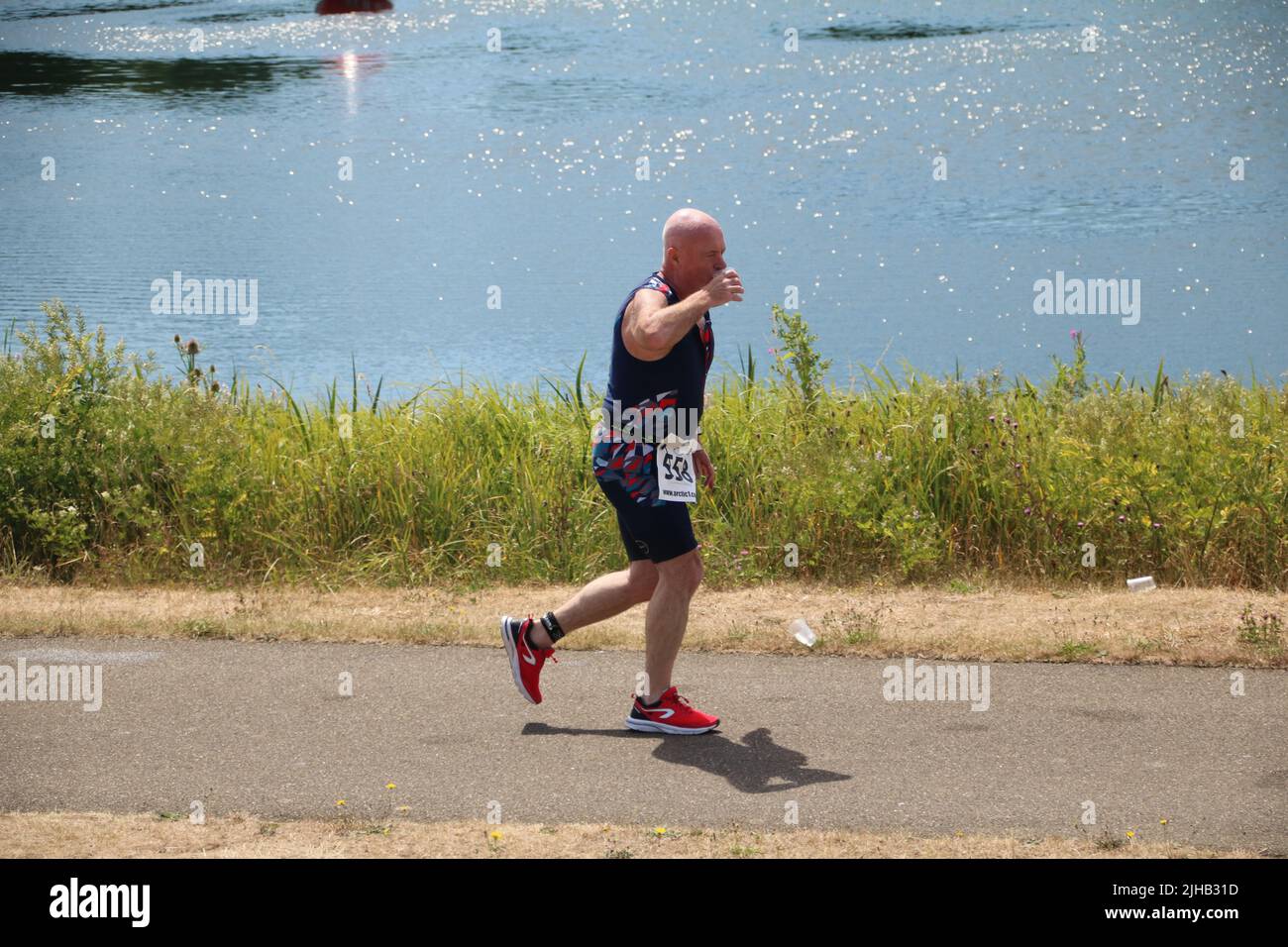 Male runner drinking hi-res stock photography and images - Alamy