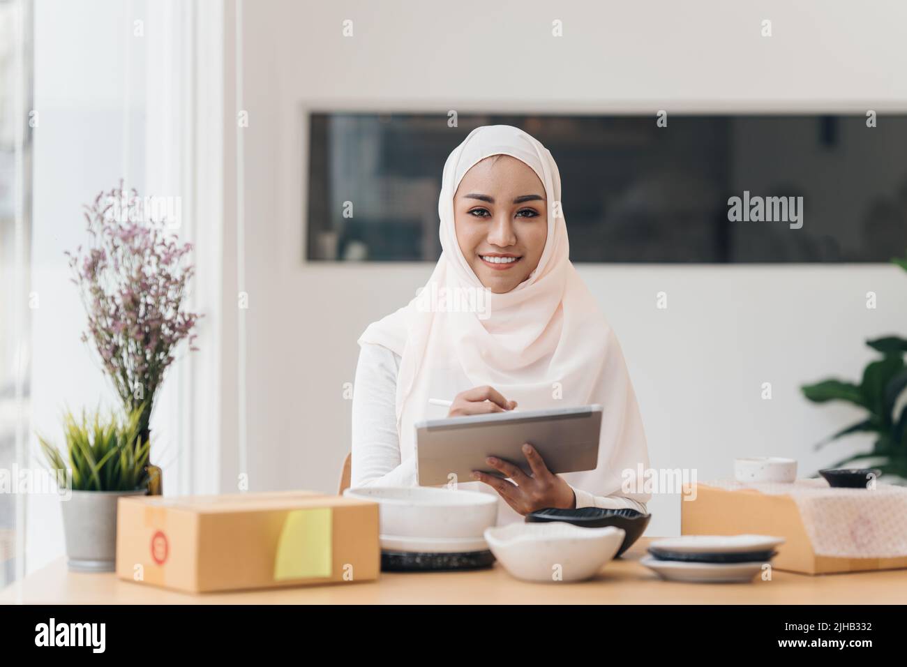 Asian small business owner working at home office. Business retail ...