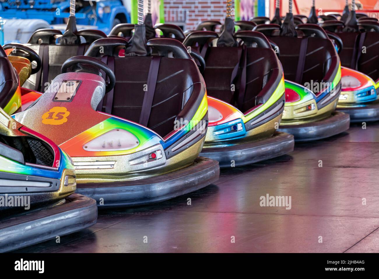row of electric bumper cars on funfair Stock Photo - Alamy