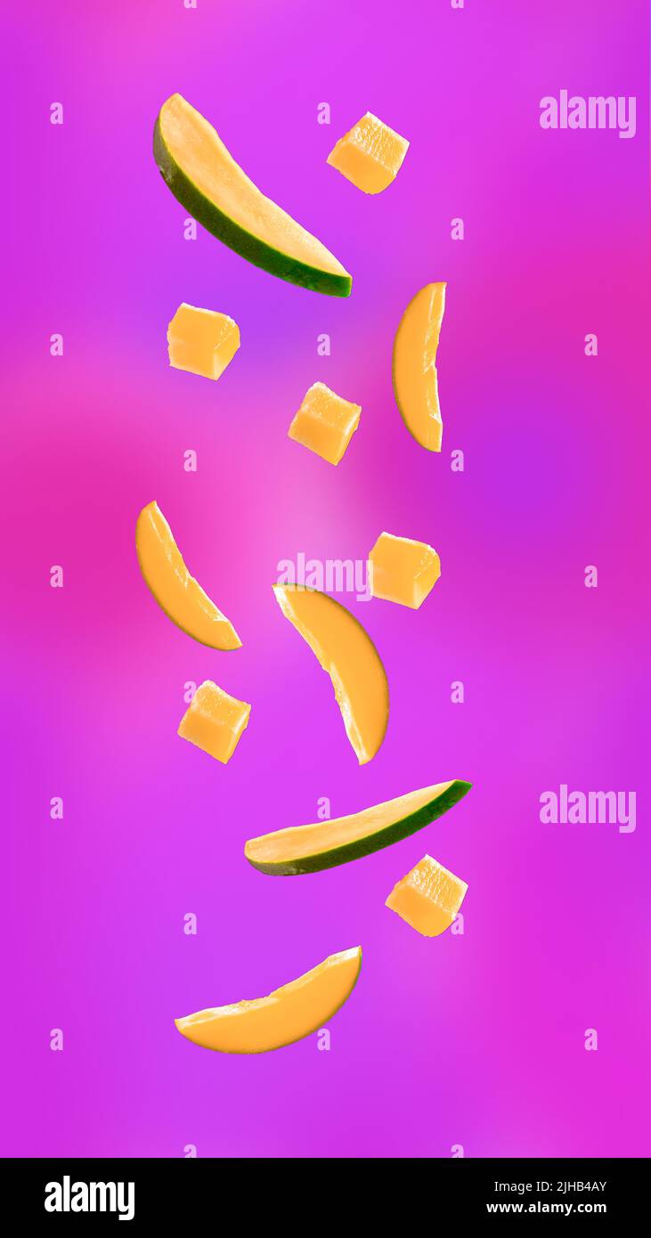 Falling slices of mango on a neon background. Club and party atmosphere ...