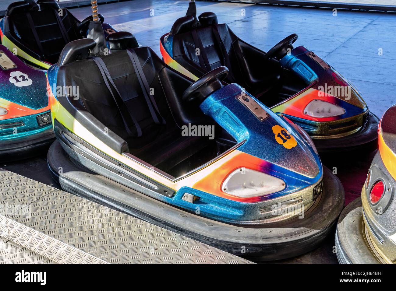 row of electric bumper cars on funfair Stock Photo - Alamy