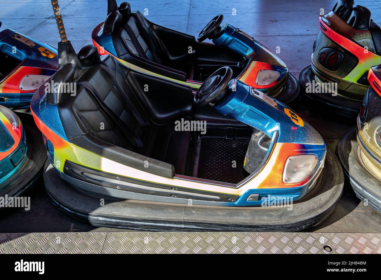 row of electric bumper cars on funfair Stock Photo - Alamy