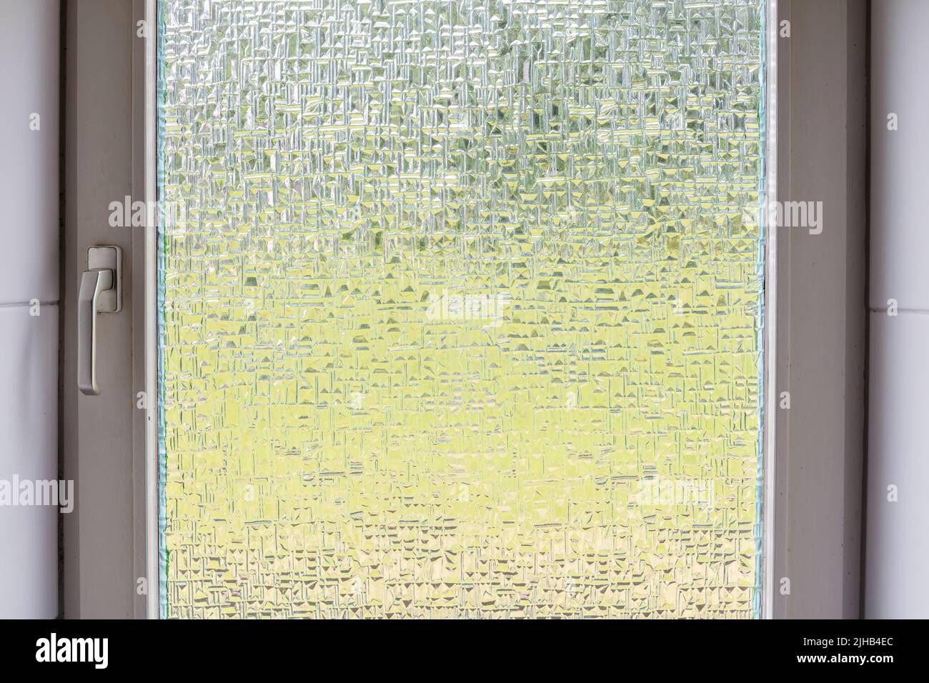 bathroom window with textured glazing Stock Photo - Alamy