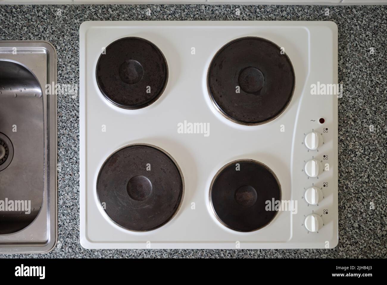 electric cooker on worktop in kitchen Stock Photo - Alamy
