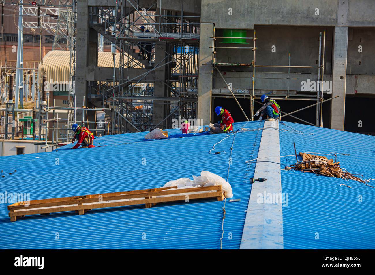 Construction industry engineer foreman standing roof for worker team to ...