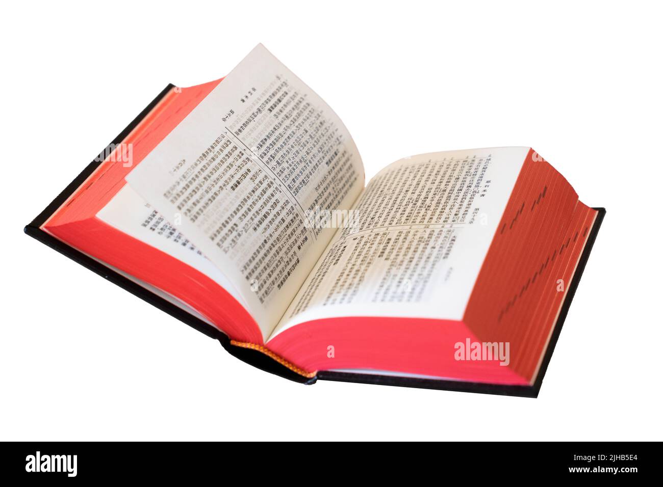 An open book with Chinese hieroglyphs and red paper edges on a white ...
