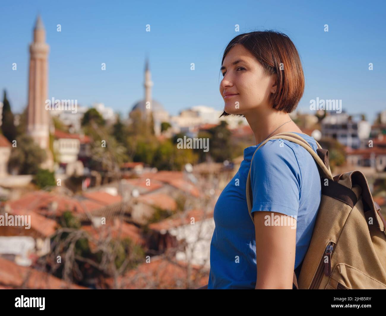 travel to Turkey, old town Antalya Kaleci. Happy asian female tourist ...