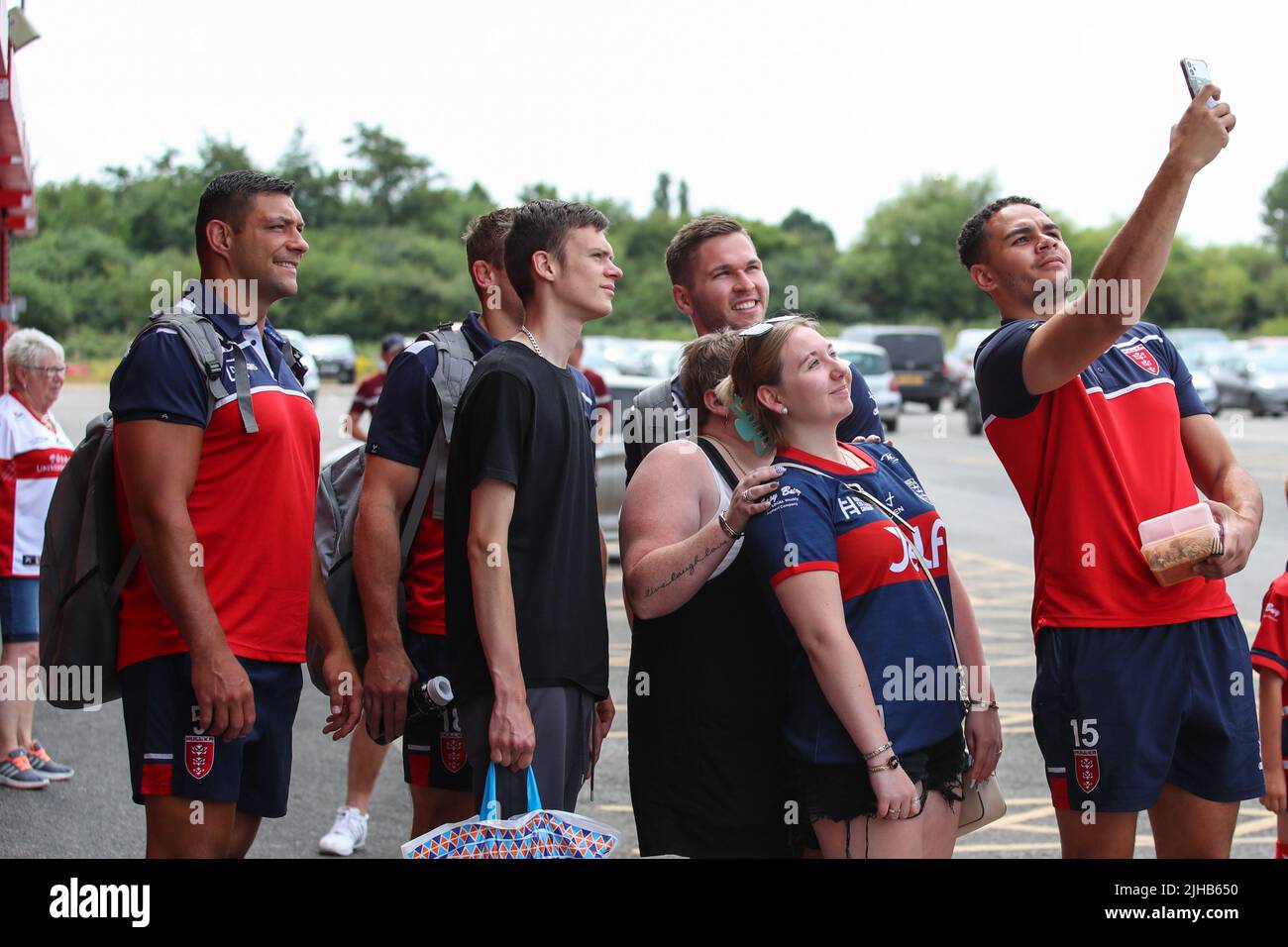 Hull Kingston Rovers players have a photograph taken with a fan Stock ...